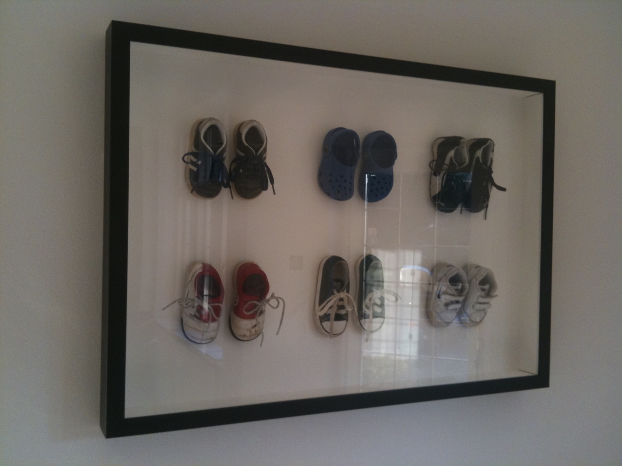 Framed 6 pairs of Children's Shoes in deep shadowbox